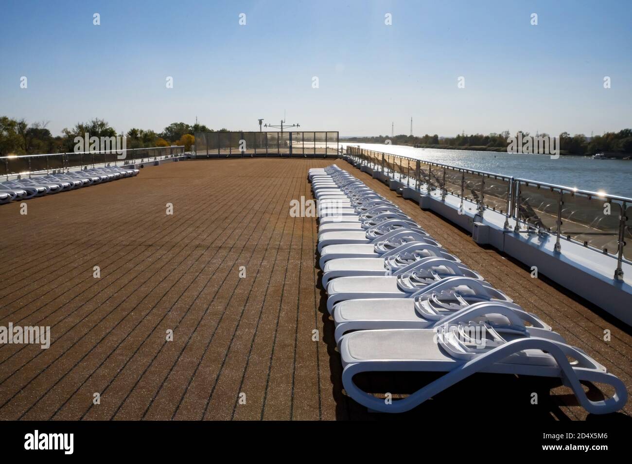Cruise ship sun deck with line of lounge chairs Stock Photo - Alamy