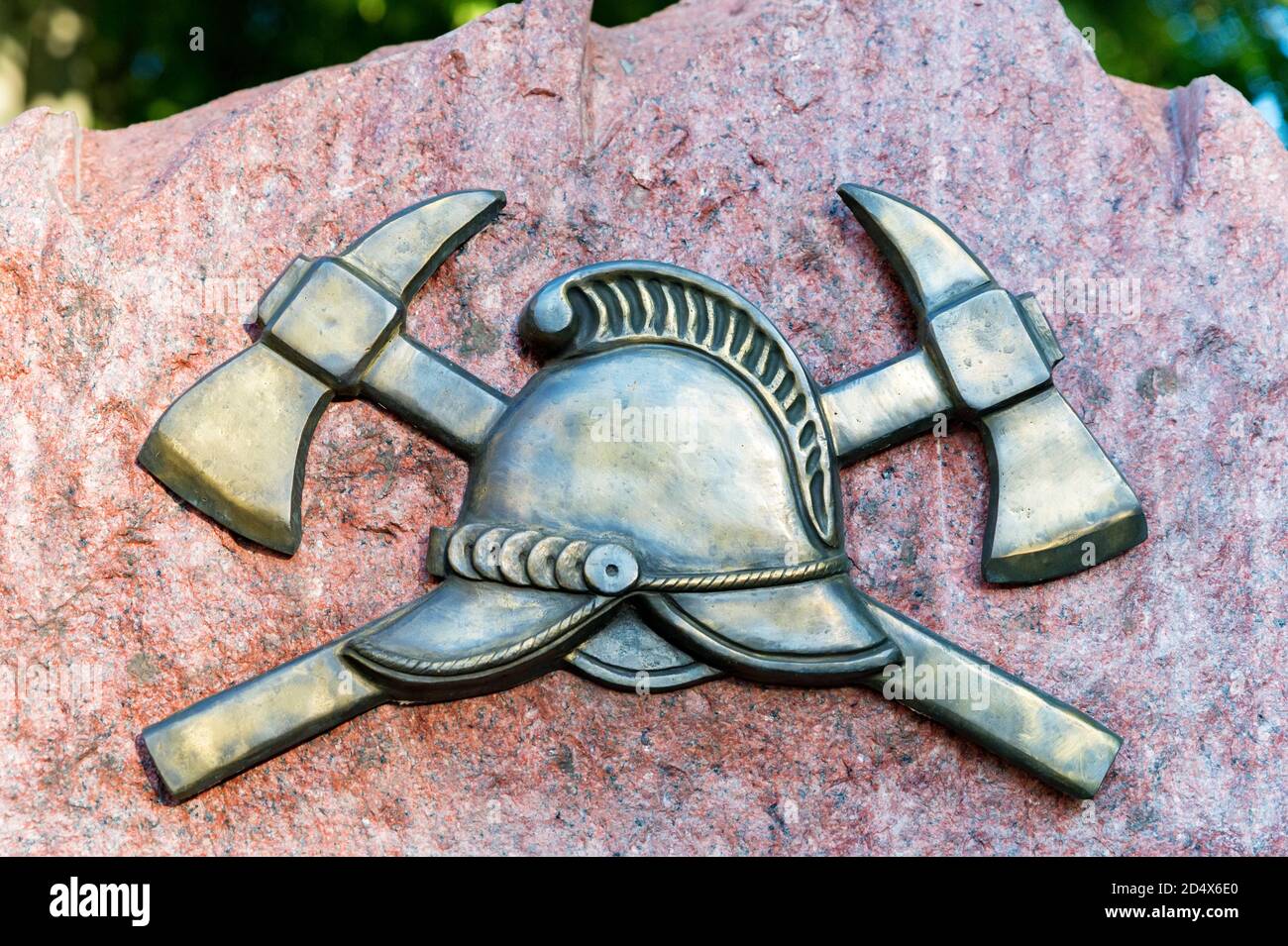 Close up of metal symbol of firefighters on a stone slab Stock Photo ...