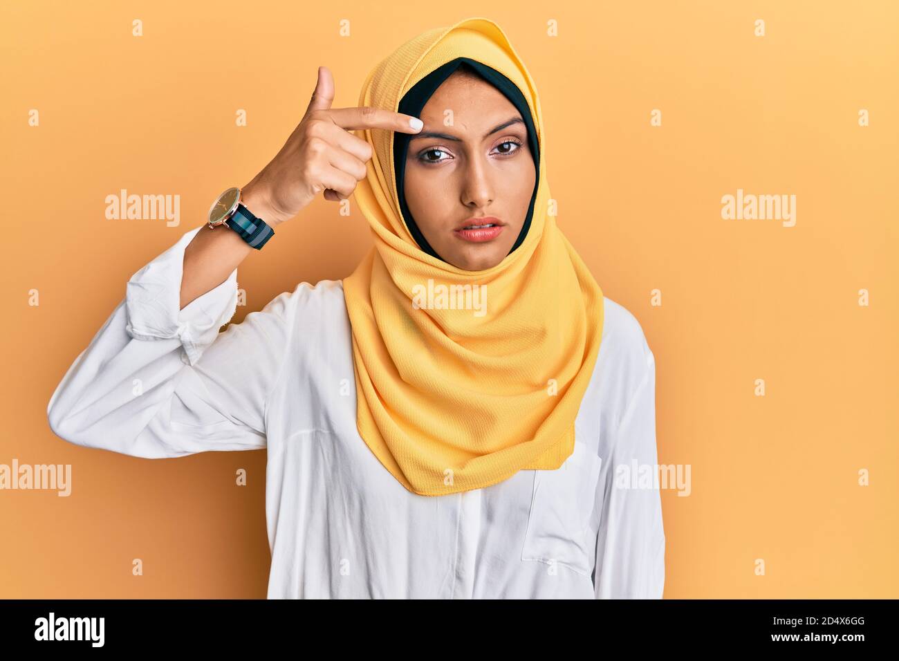 Young brunette arab woman wearing traditional islamic hijab scarf ...