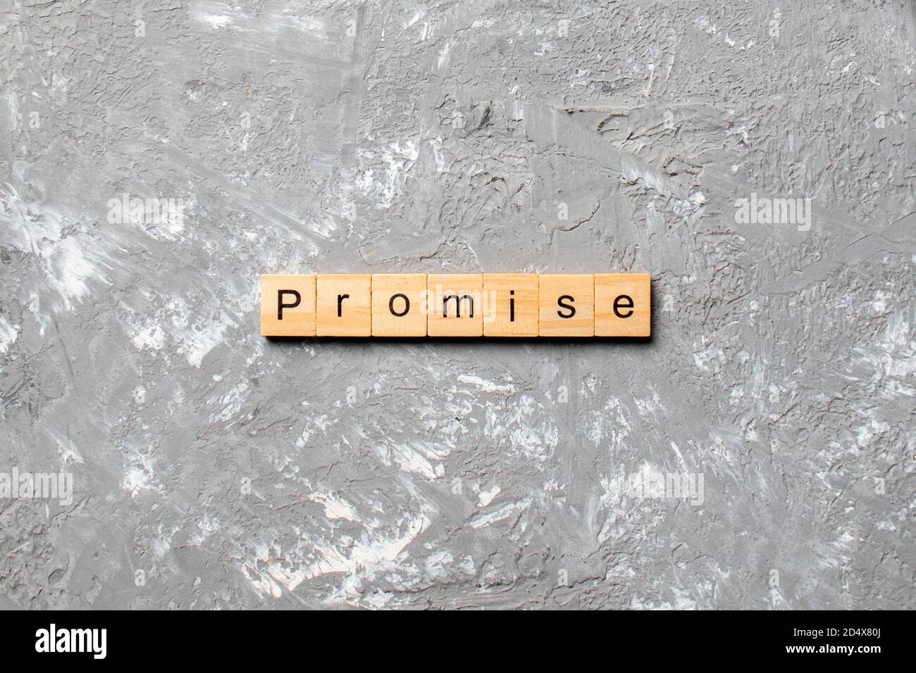 Promise word written on wood block. Promise text on cement table for ...