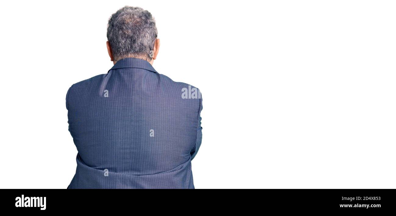 Senior grey-haired man wearing business jacket standing backwards ...