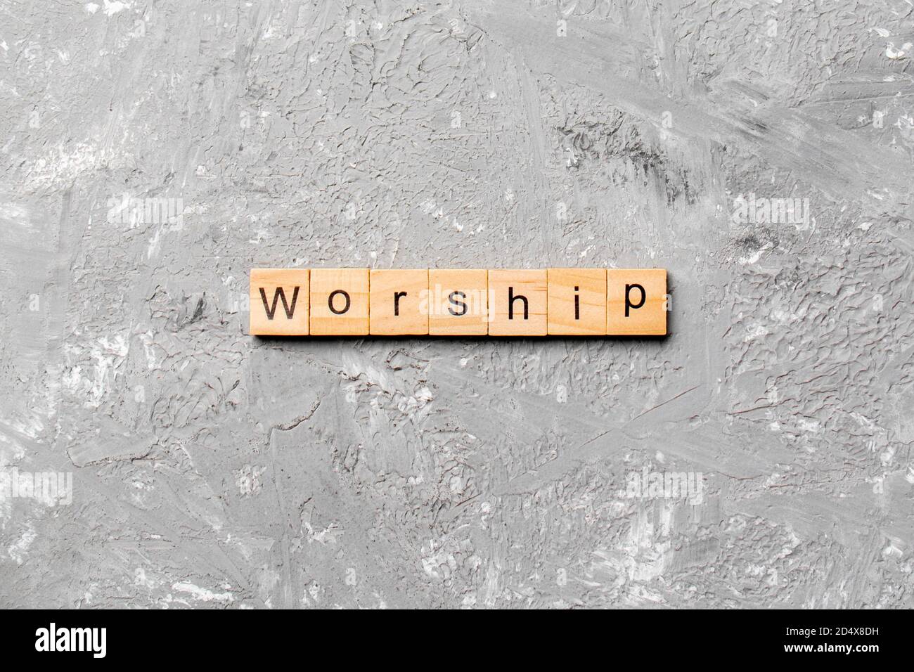 Worship word written on wood block. Worship text on cement table for ...
