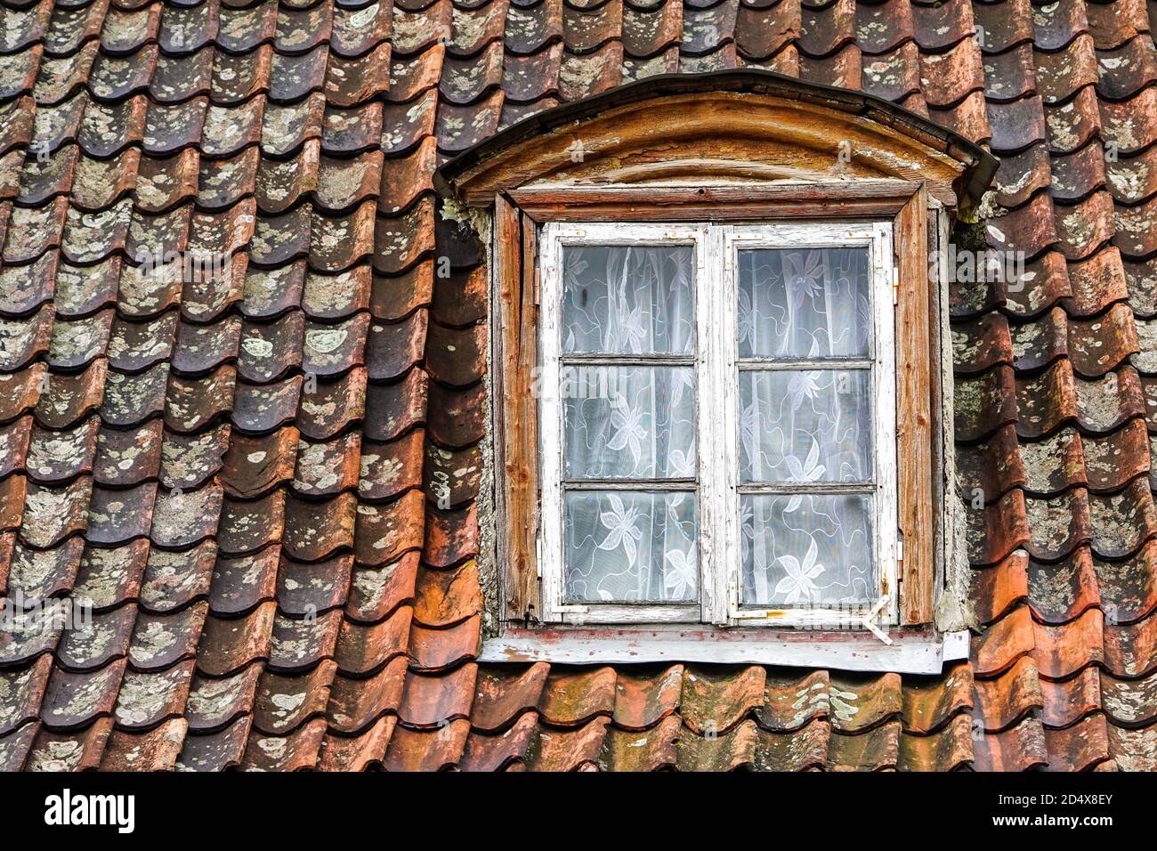 old house clay tile roof with a romantic window Stock Photo - Alamy