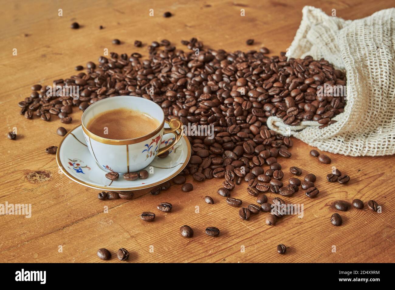 Vintage espresso cup on a wooden table. Antique espresso cup and coffee ...