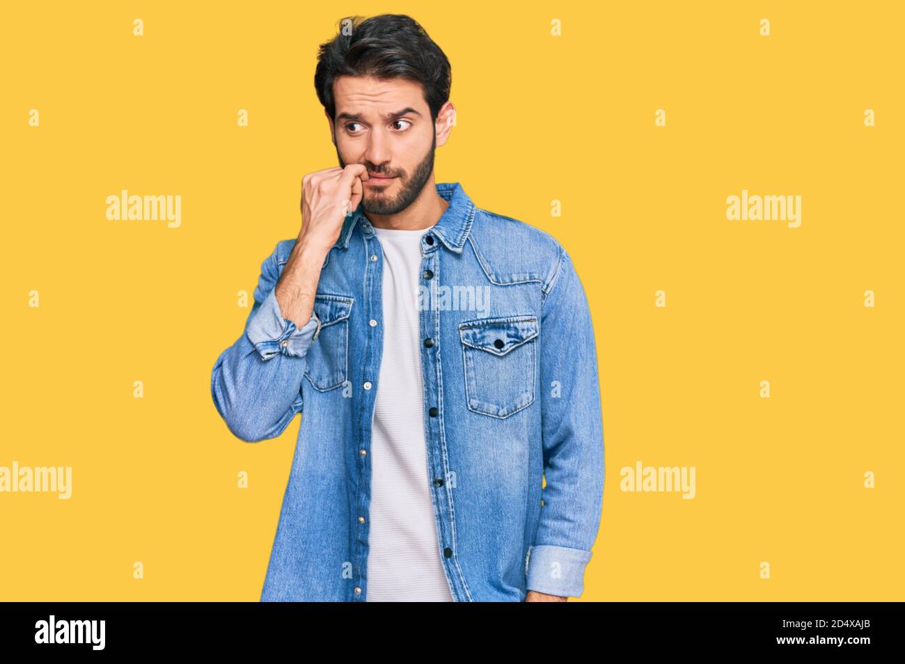 Young hispanic man wearing casual clothes looking stressed and nervous ...