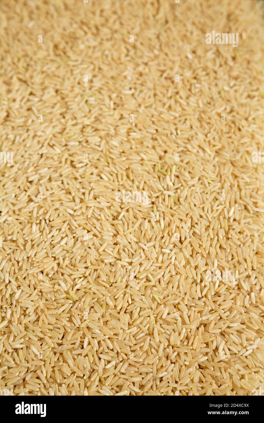 Dry Brown Rice background, side view Stock Photo - Alamy