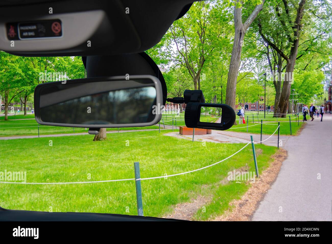 Looking through a dashcam car camera installed on a windshield with ...