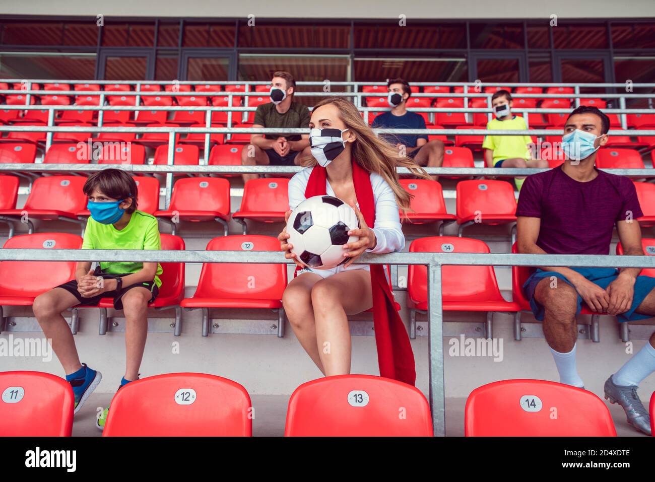 Fans with masks during covid-19 in soccer stadium keeping distance ...