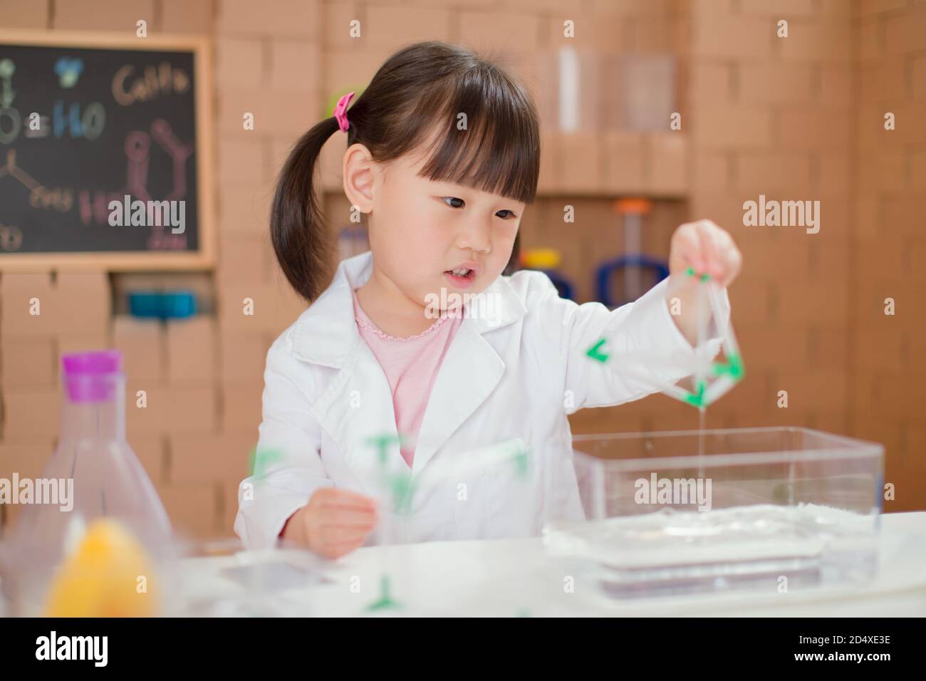 young girl play science experiments for home schooling Stock Photo - Alamy