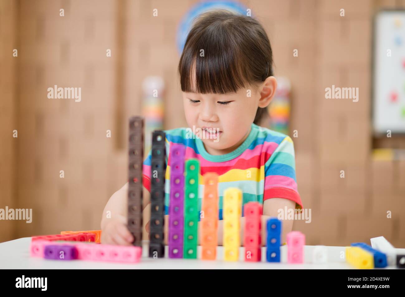 young girl play number blocks for homeschooling Stock Photo - Alamy