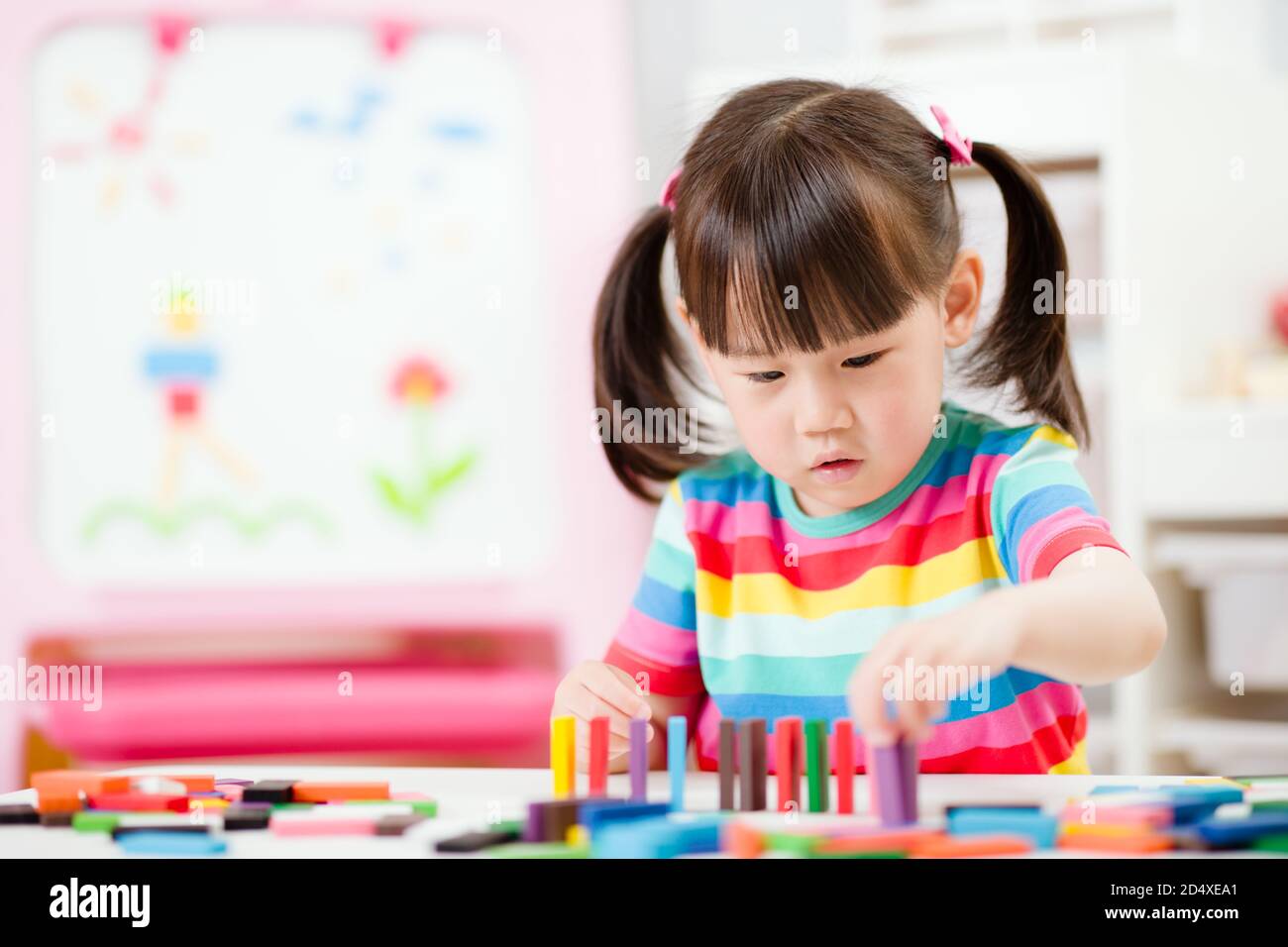 young girl play number sticks fine motor skill game for homeschooling ...