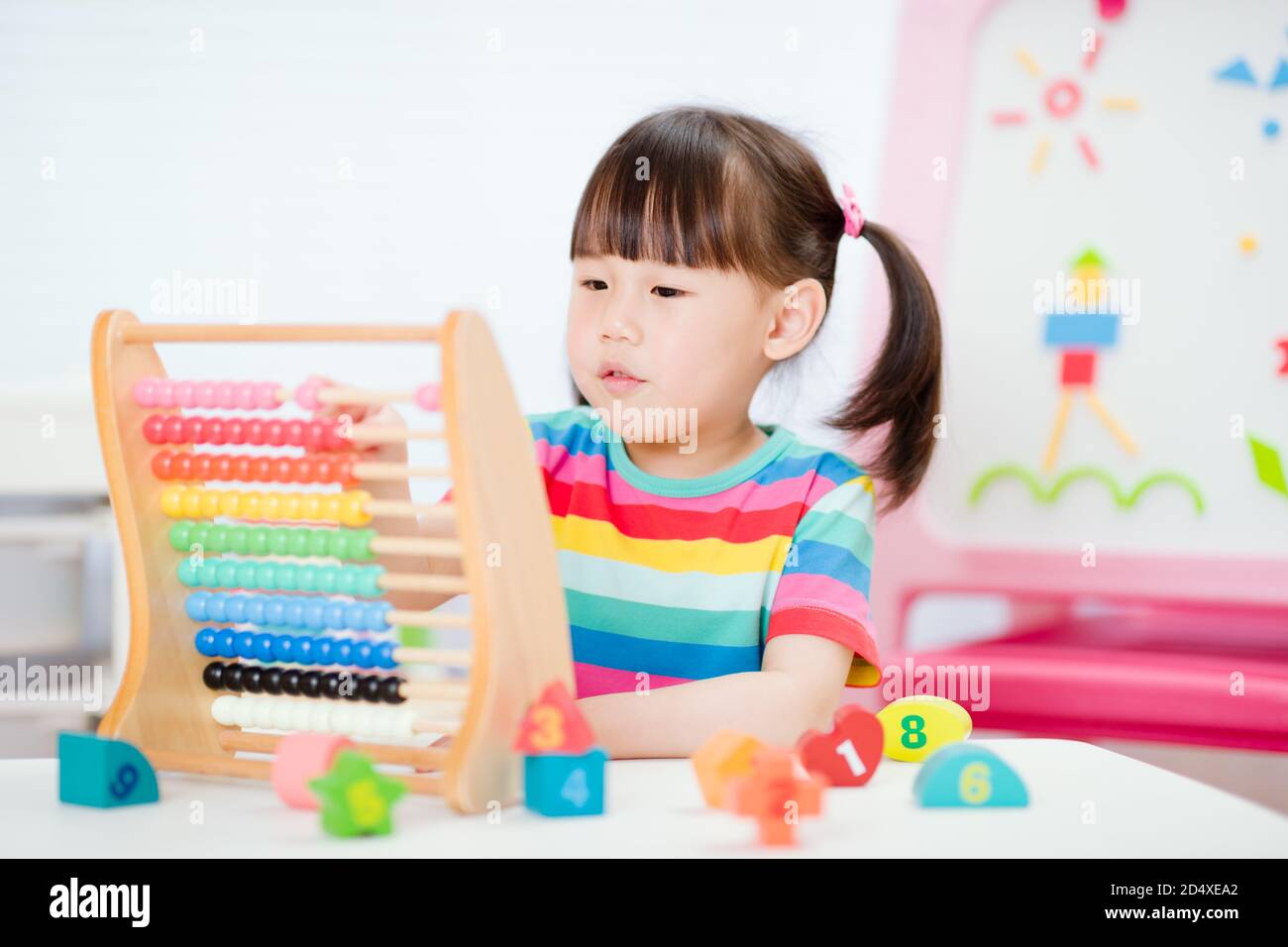 young girl learn counting by using abacus for homeschooling Stock Photo ...