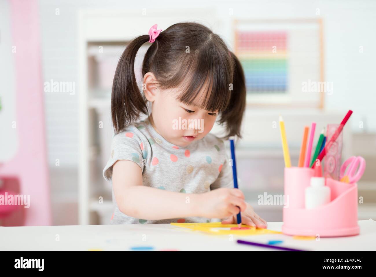 young girl practice drawing different shapes for homeschooling Stock ...