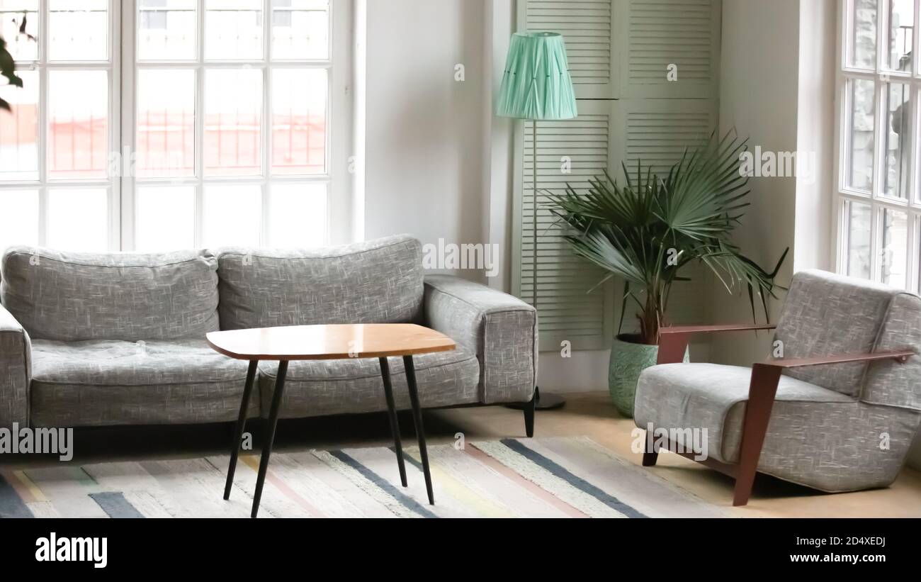 Modern empty design living room with couch and armchair Stock Photo - Alamy