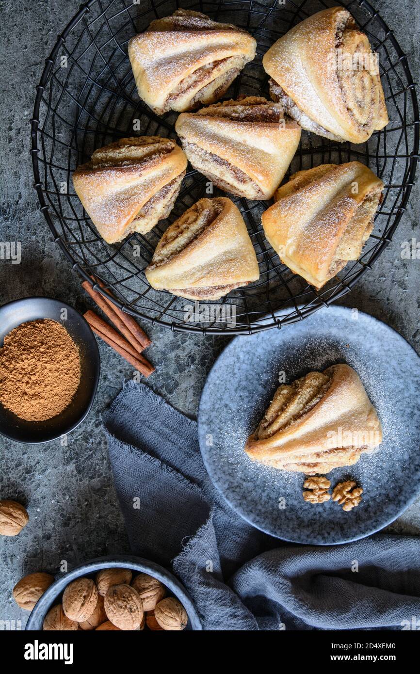Rolled triangle pies with walnut and cinnamon filling Stock Photo - Alamy