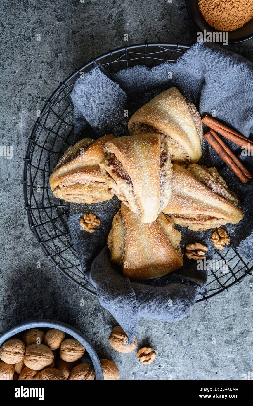 Rolled triangle pies with walnut and cinnamon filling Stock Photo - Alamy