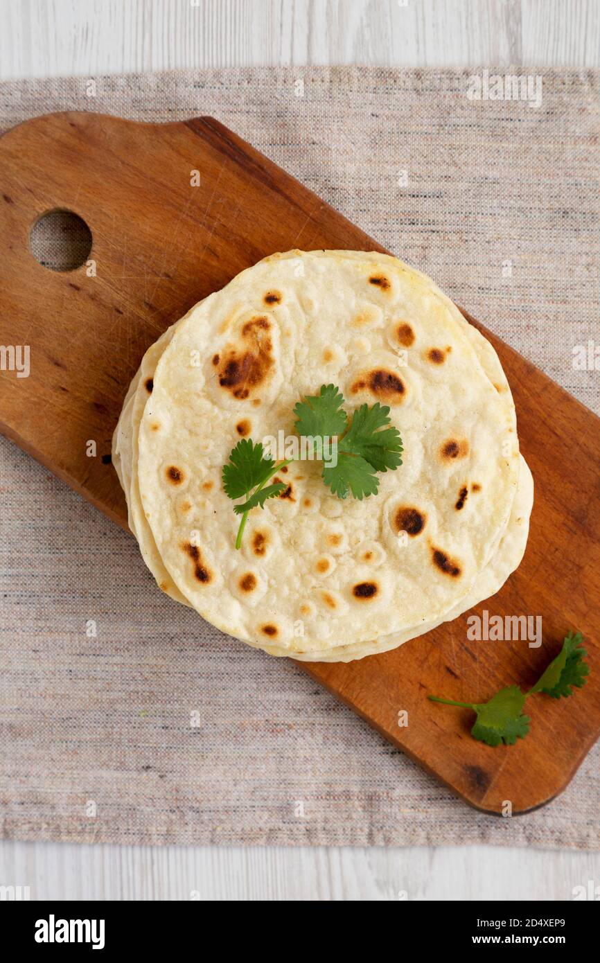 Homemade Roti Chapati Flatbread on a rustic wooden board, top view ...