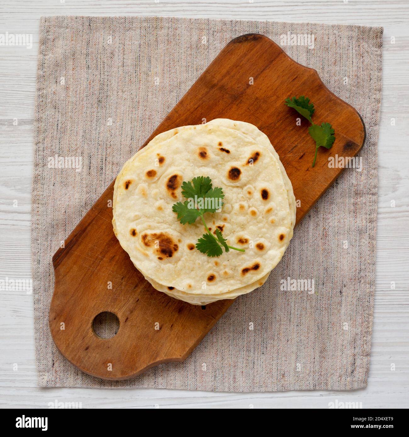 Homemade Roti Chapati Flatbread on a rustic wooden board, top view ...