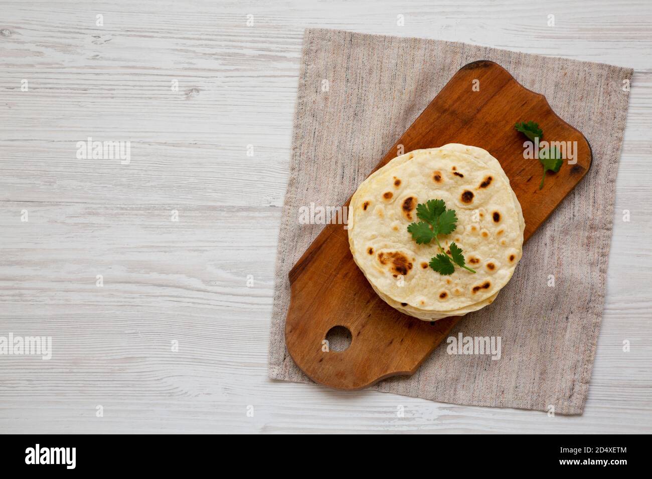 Homemade Roti Chapati Flatbread on a rustic wooden board, top view ...