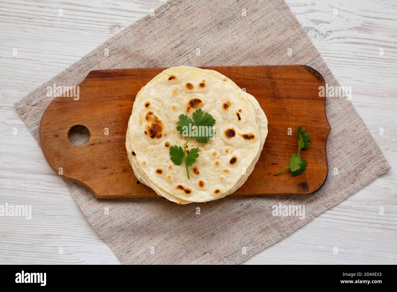 Homemade Roti Chapati Flatbread on a rustic wooden board, top view ...