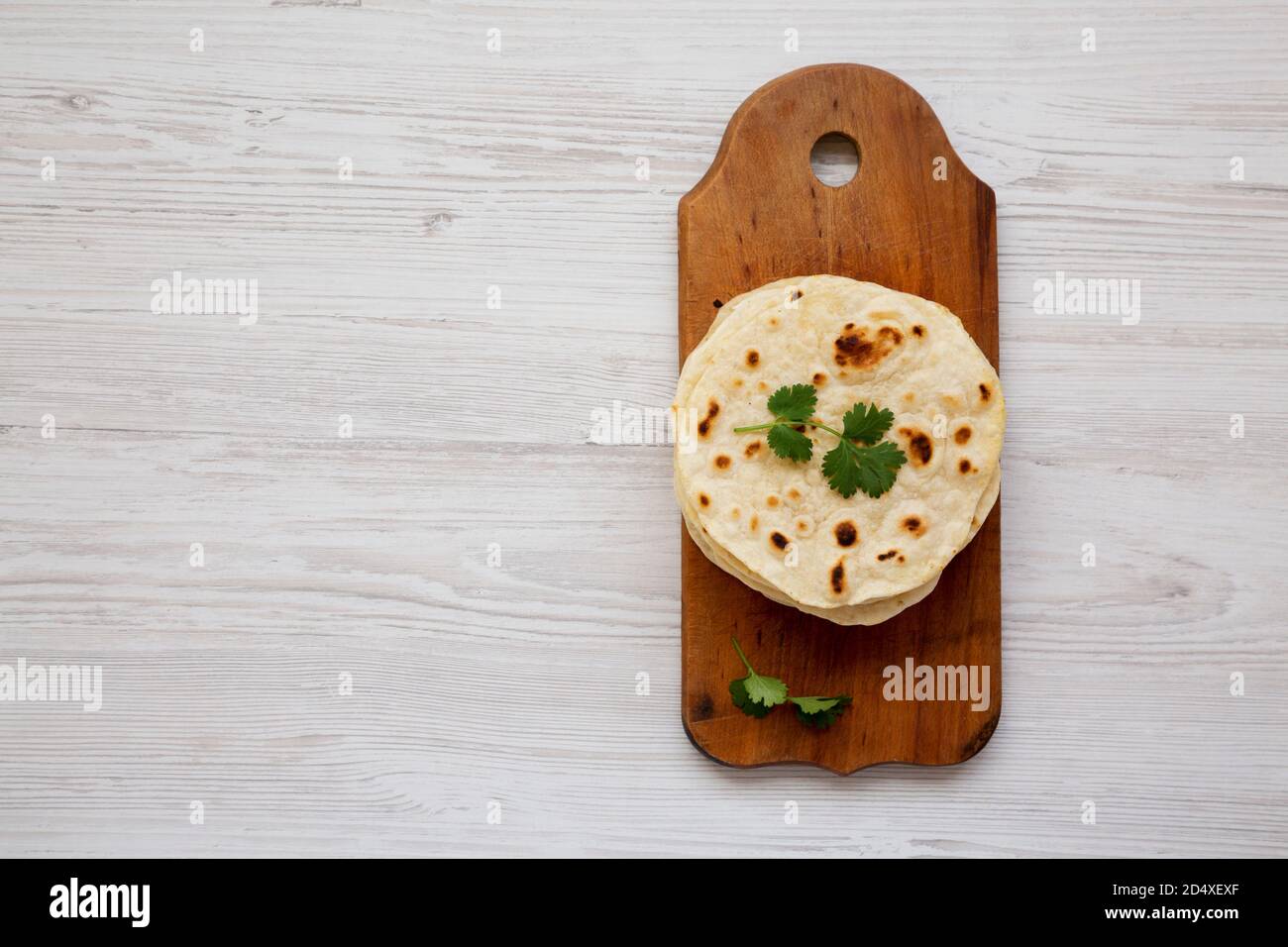Homemade Roti Chapati Flatbread on a rustic wooden board, top view ...