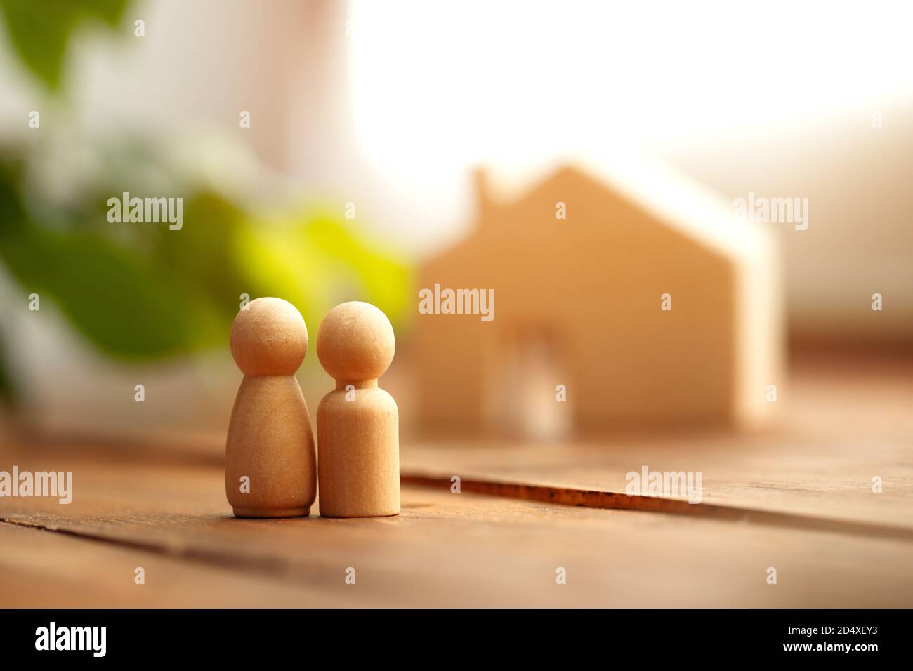Wooden men figures and toy wooden house Stock Photo - Alamy