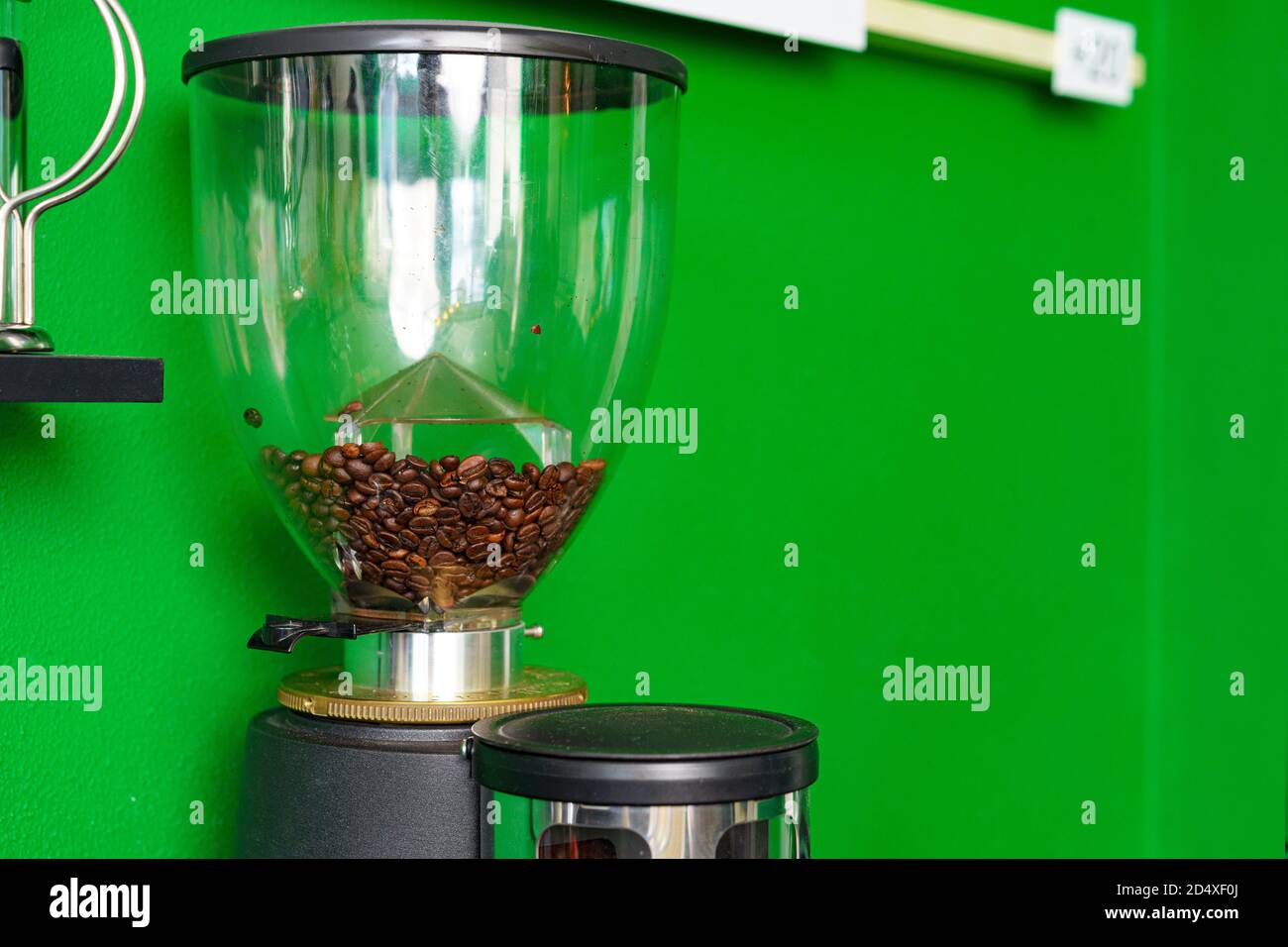 Professional coffee grinder machine in coffee shop Stock Photo - Alamy