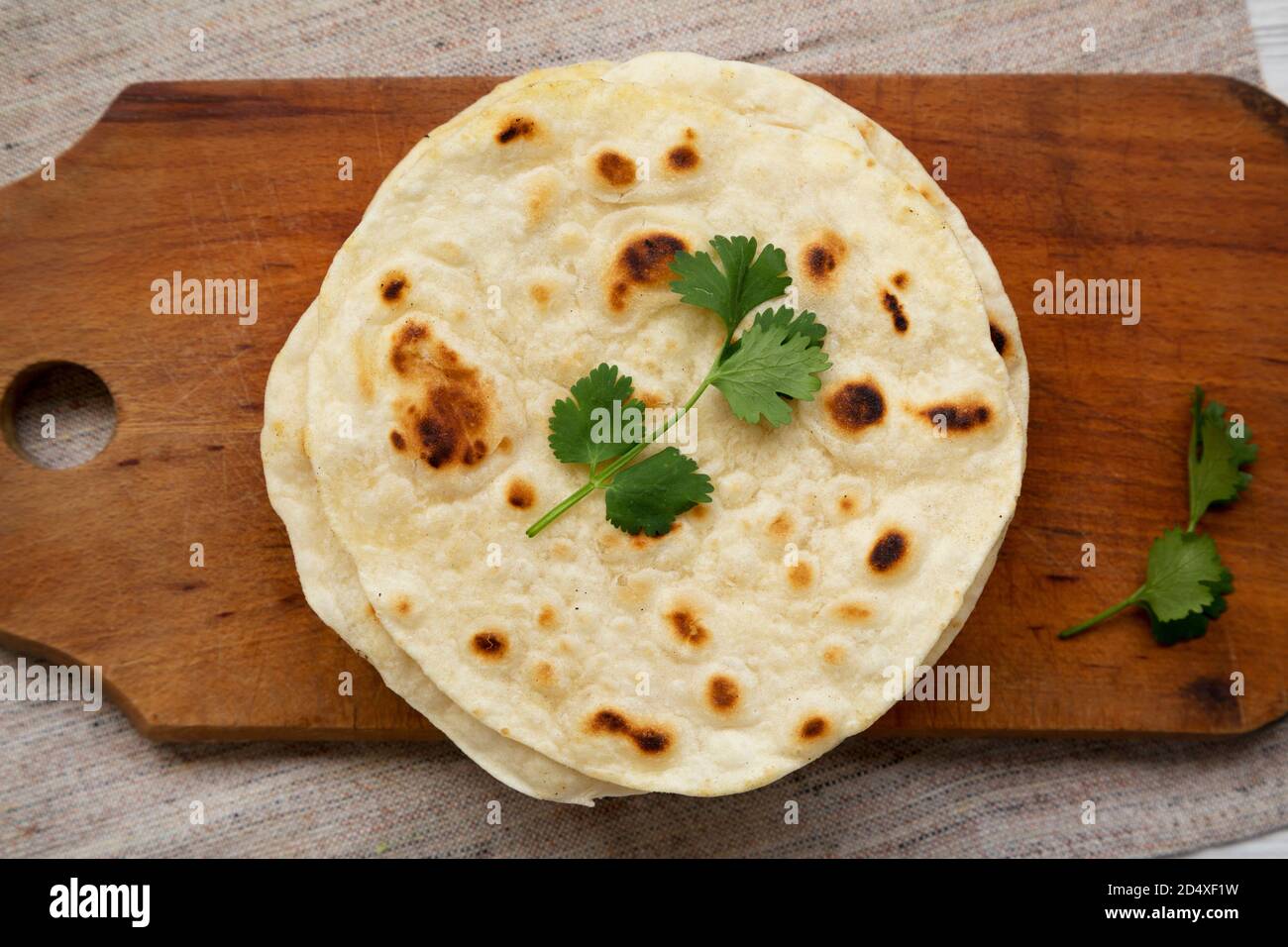Homemade Roti Chapati Flatbread on a rustic wooden board, top view ...