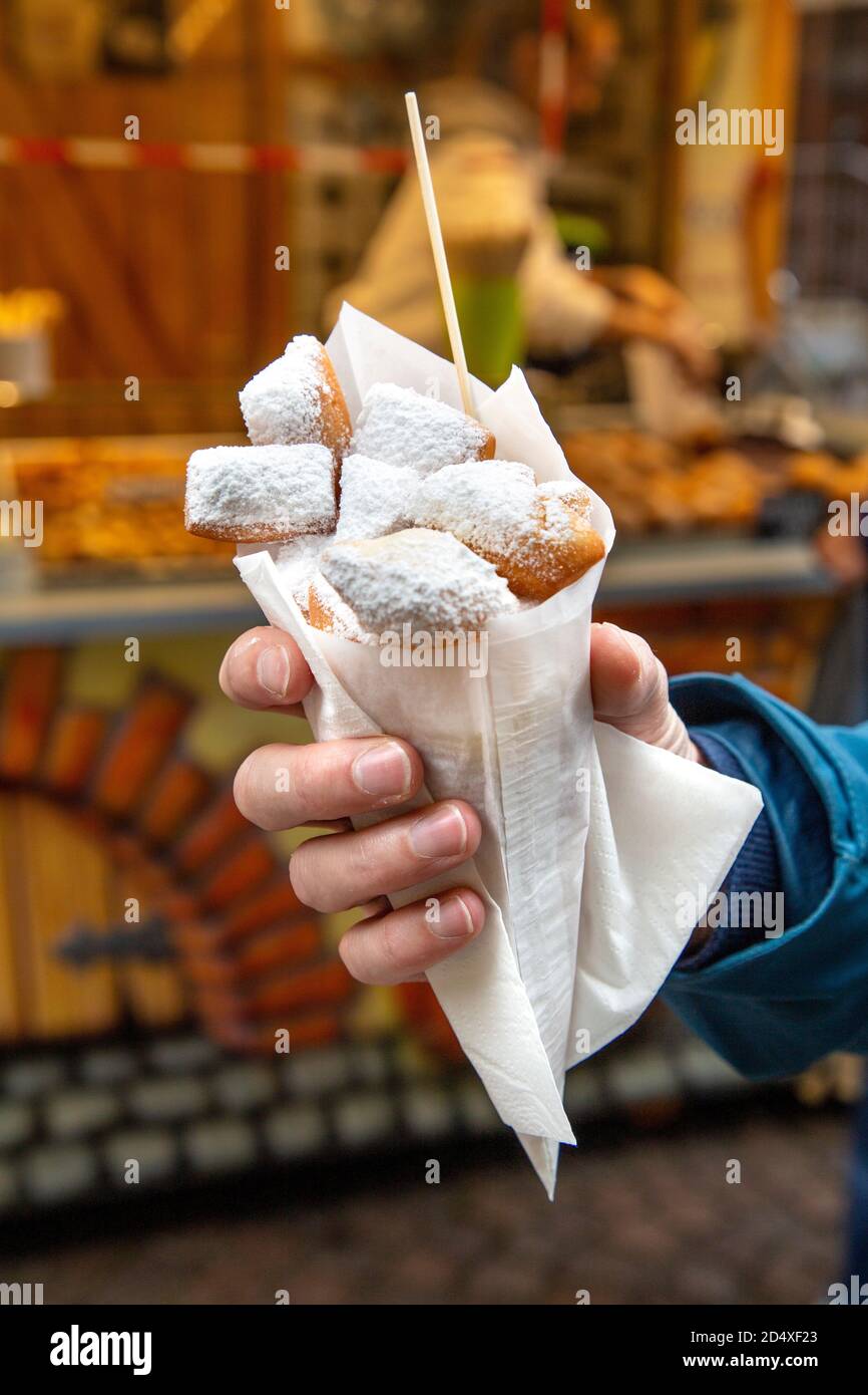 A cone of Schmalzkuchen typical little German doughnuts in Bremen ...