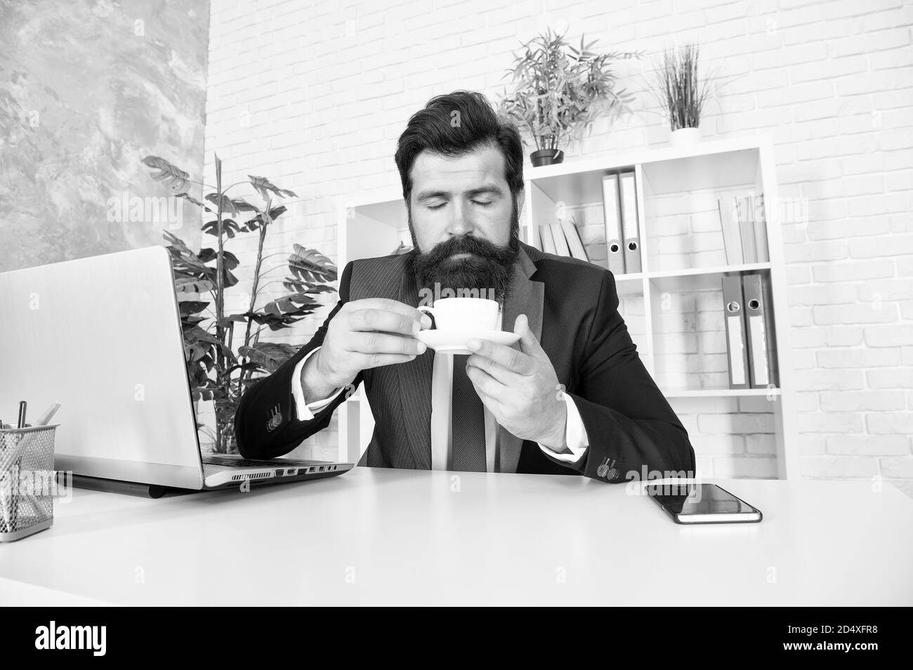 Bearded man enjoying hot Black and White Stock Photos & Images - Alamy