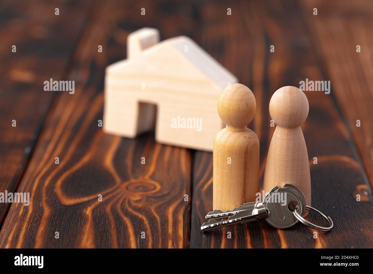 Wooden men figures and toy wooden house Stock Photo - Alamy