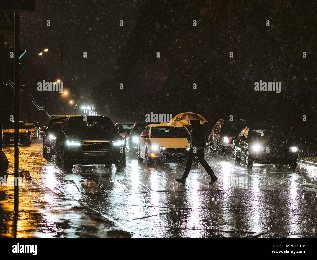 Man heavy rain hiding hi-res stock photography and images - Alamy