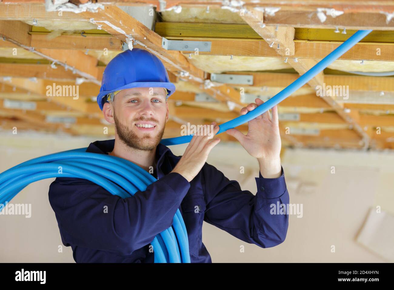 electrician checking wiring in building site Stock Photo - Alamy