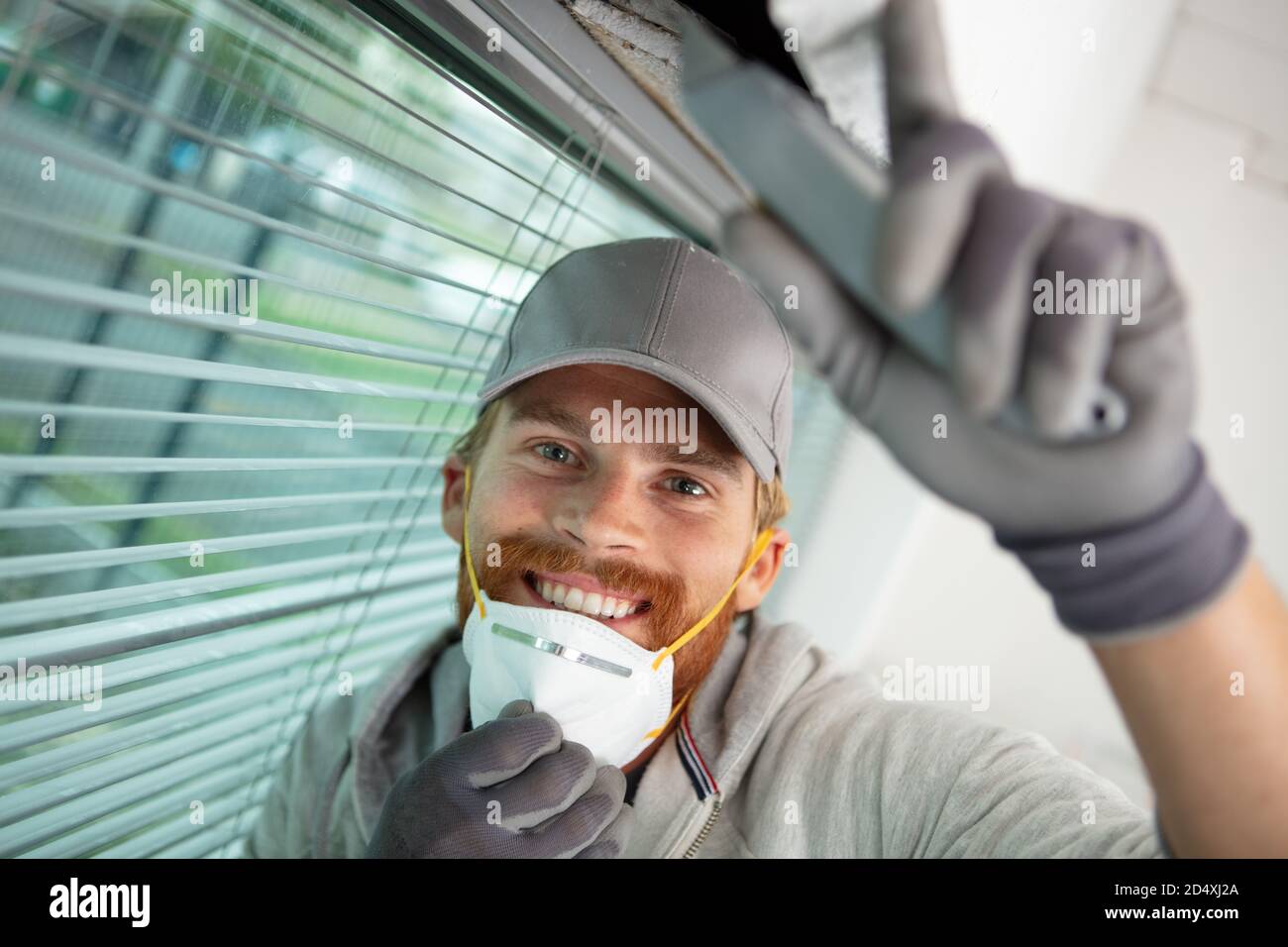 construction worker working on window in house Stock Photo - Alamy