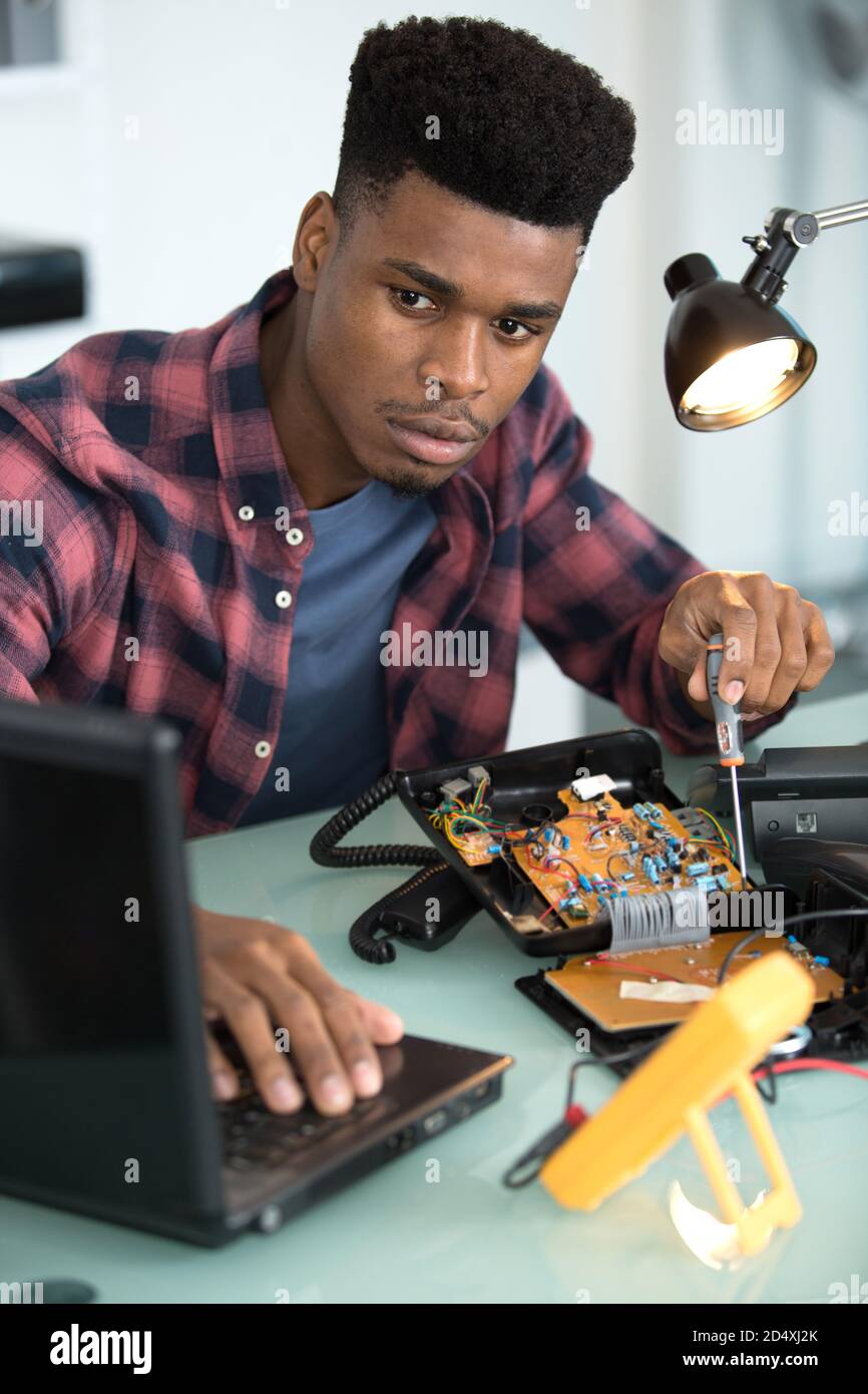 man using multimeter while fixing pc Stock Photo - Alamy