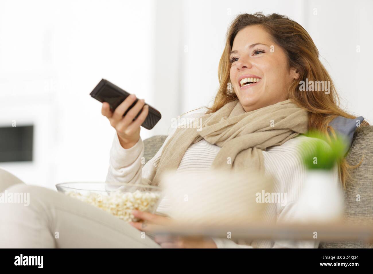 happy woman watching tv Stock Photo - Alamy