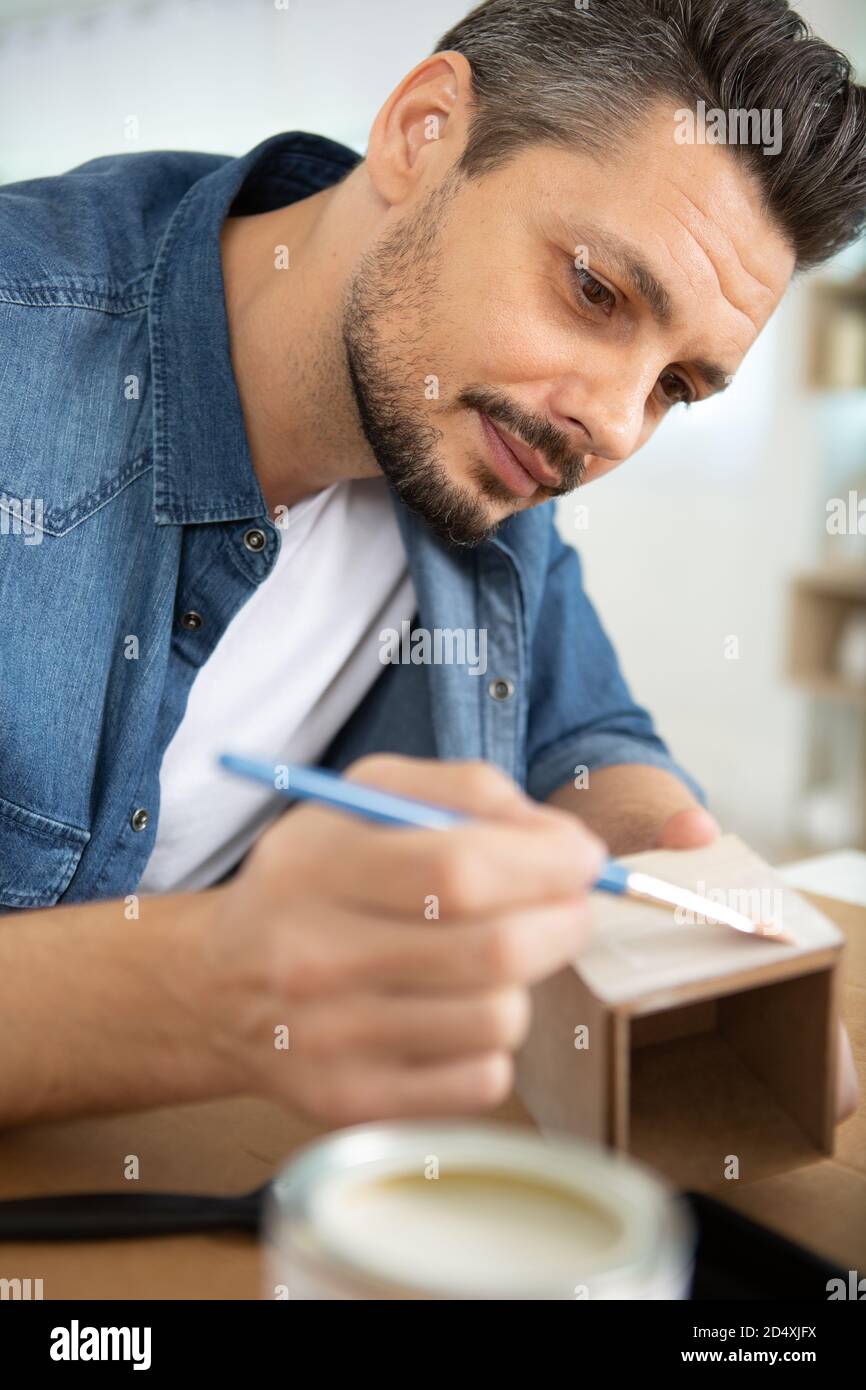 Man paintbrush mixing paints hi-res stock photography and images - Alamy