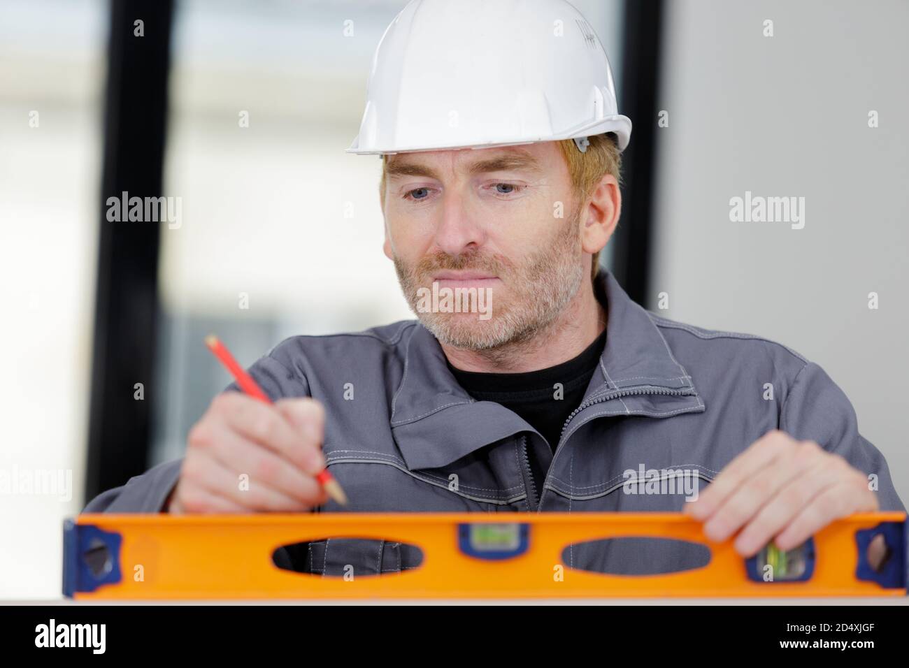 Spirit level yellow pencil hi-res stock photography and images - Alamy