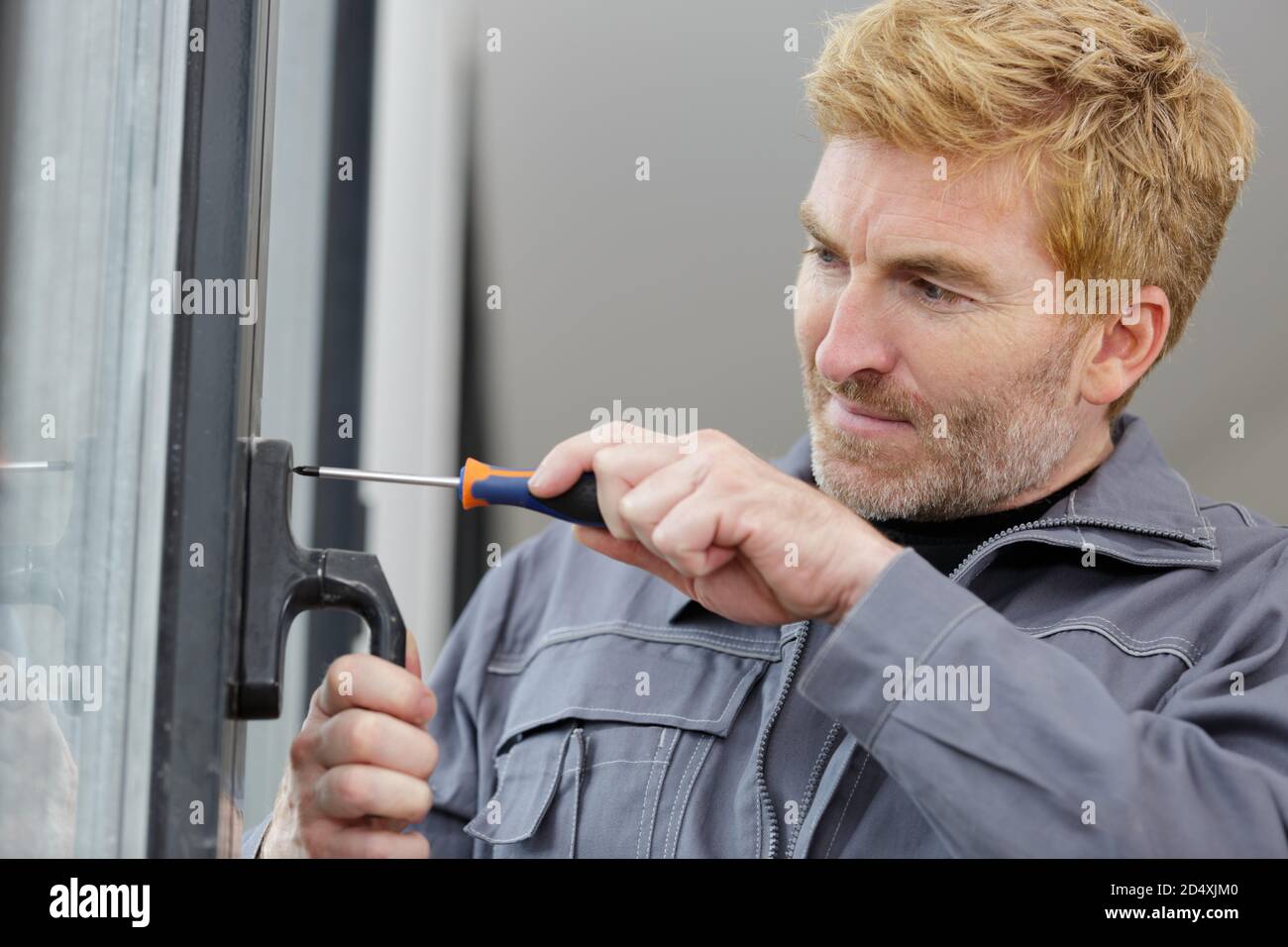 construction worker installing window in house Stock Photo - Alamy