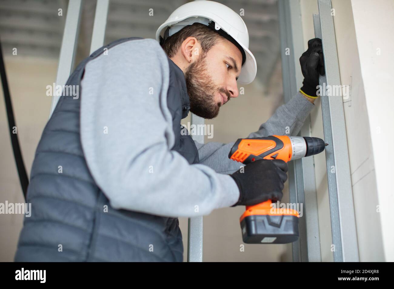 man fitting window and wall in a new house Stock Photo - Alamy