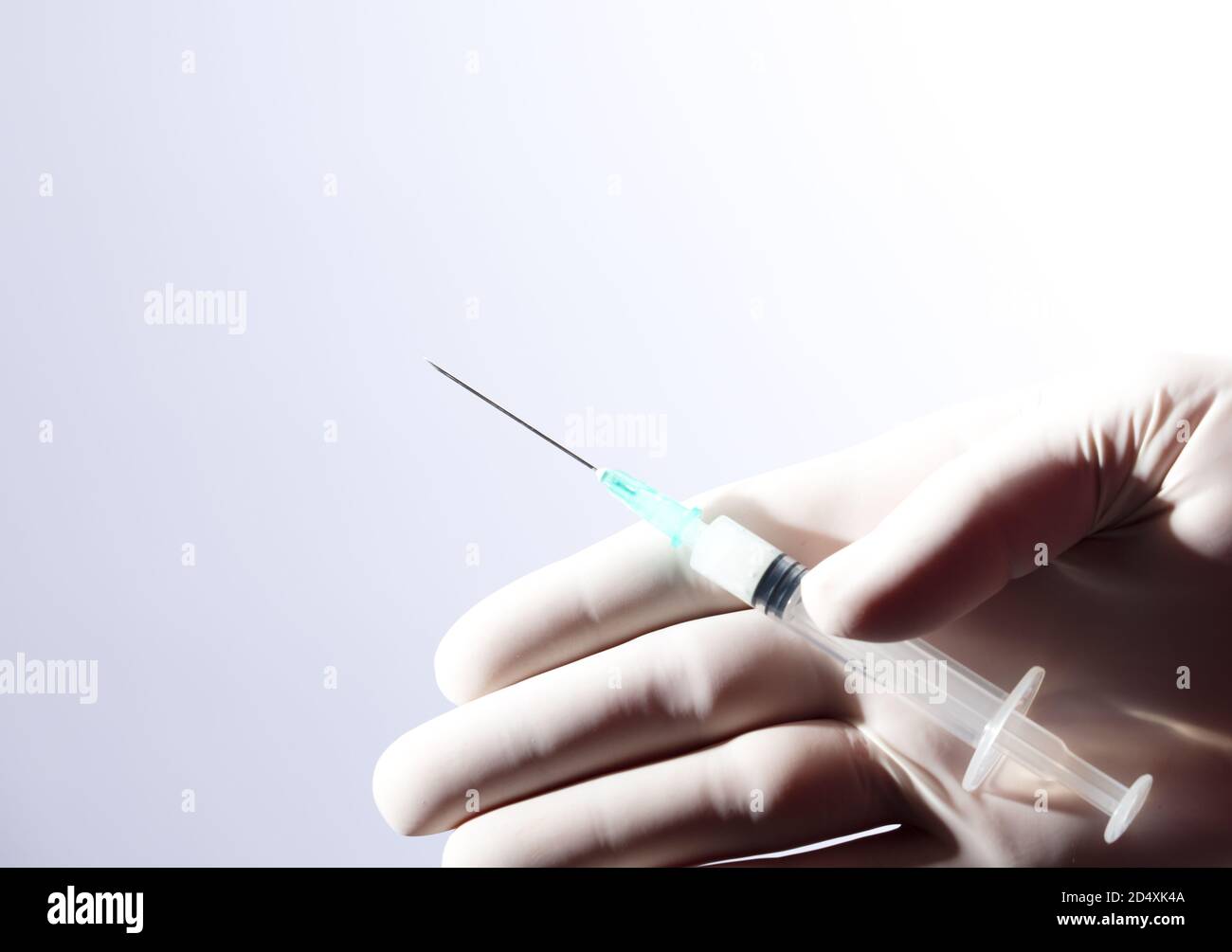 Syringe, medical injection in the hand, palm or fingers. Plastic ...