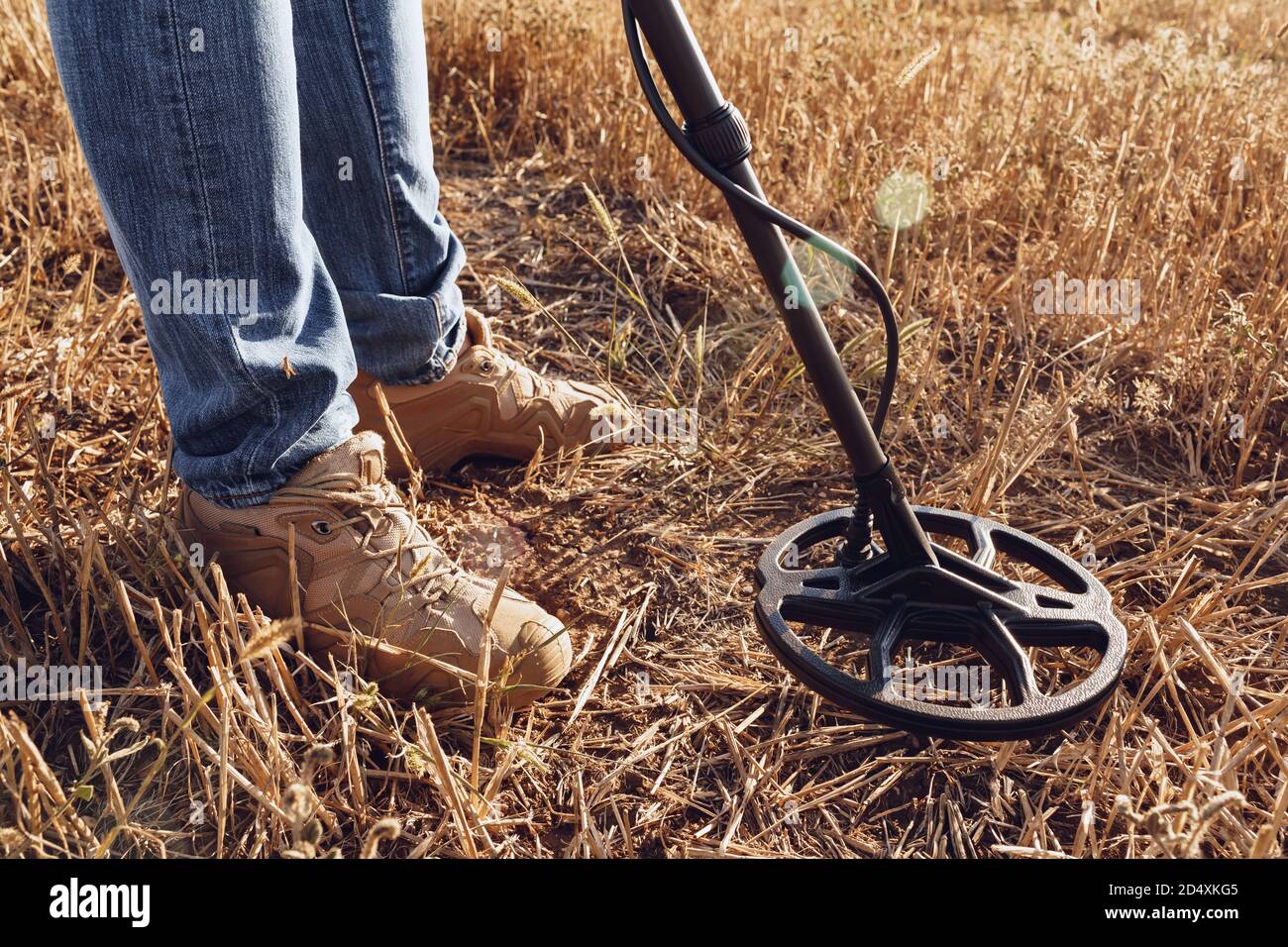 Man with metal detector equipment searching for metal goods in the ...