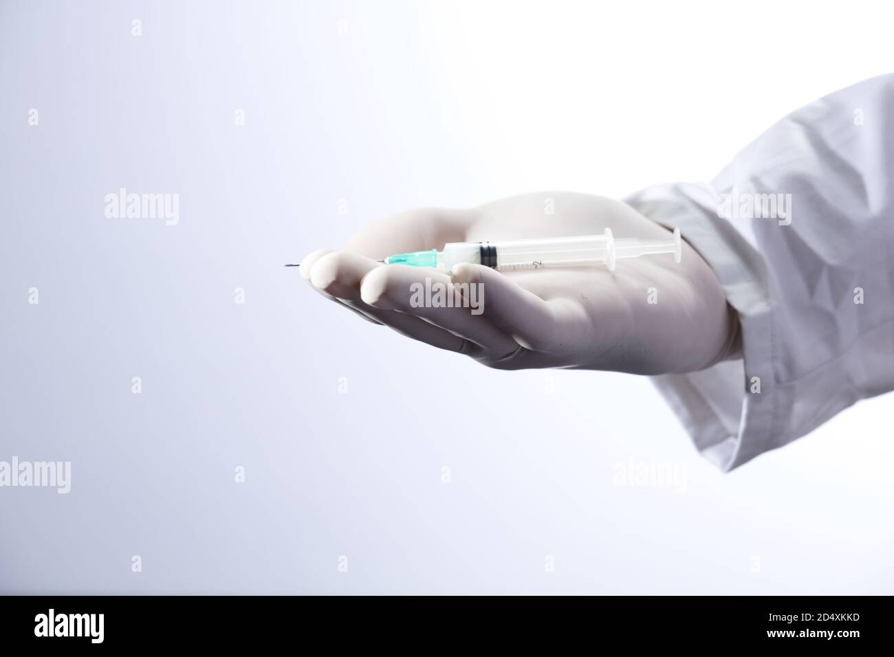 Syringe, medical injection in the hand, palm or fingers. Plastic ...