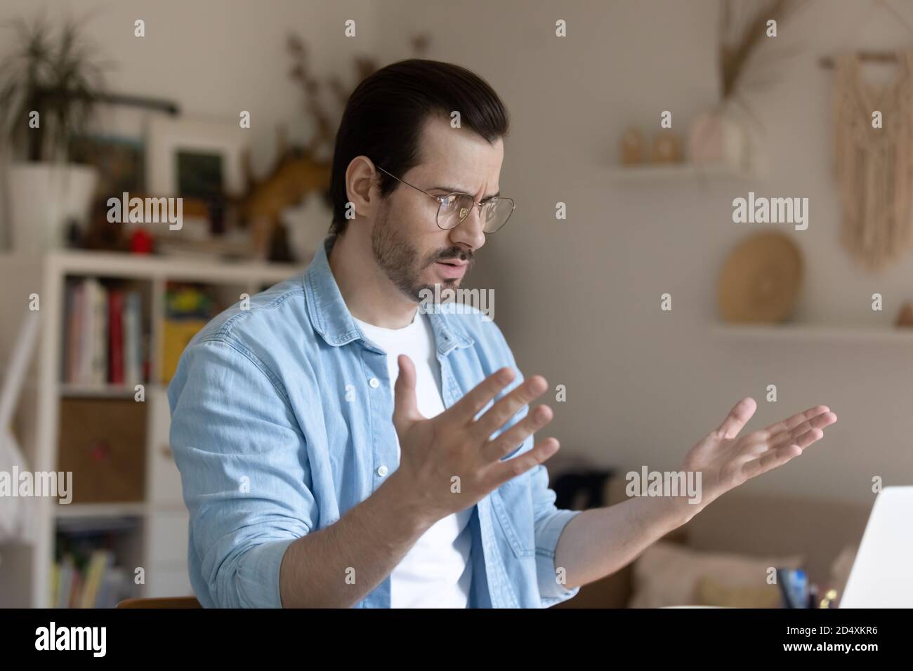 Confused young man feeling angry about received bad news Stock Photo ...