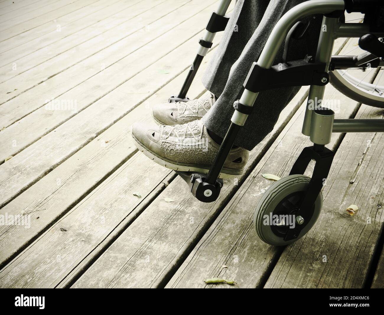 Close-up of the legs of a disabled woman in a wheelchair Stock Photo ...