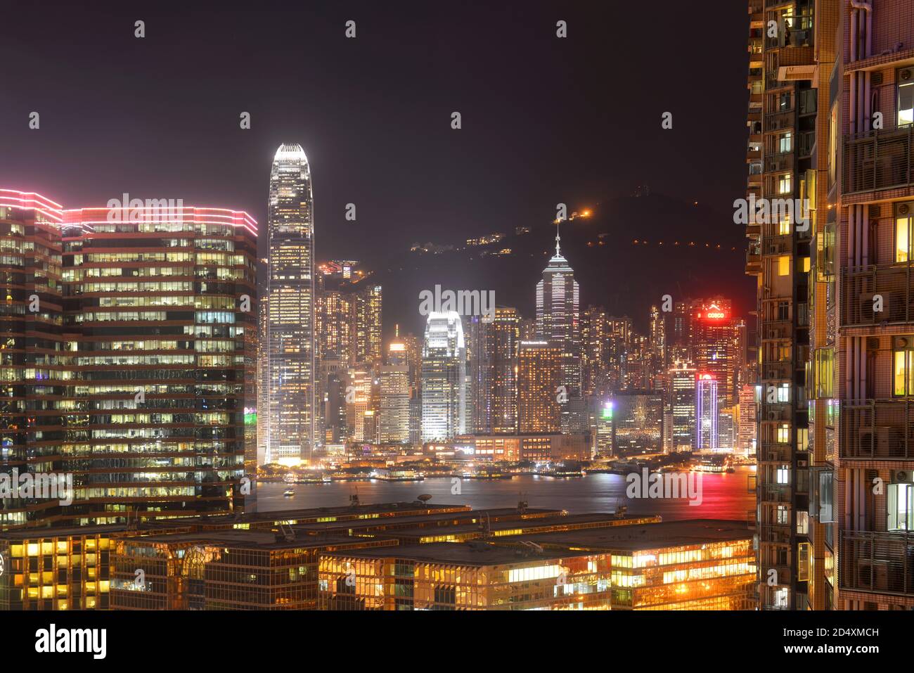 Hong Kong Skyline and Victoria Harbour at night from Tsim Sha Tsui on Kowloon in Hong Kong ...