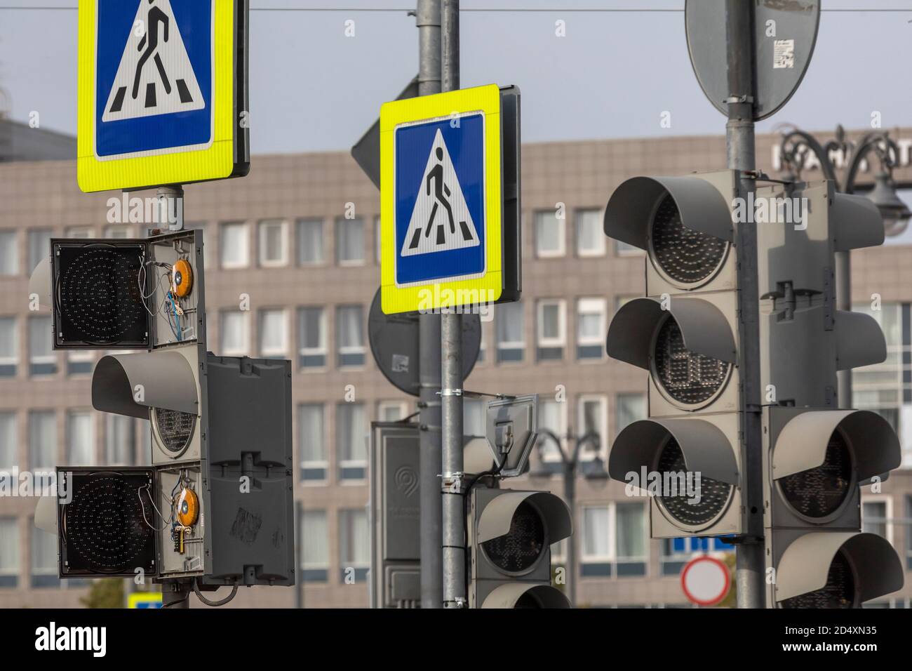 Road signs and traffic lights at intersections in the city Stock Photo ...