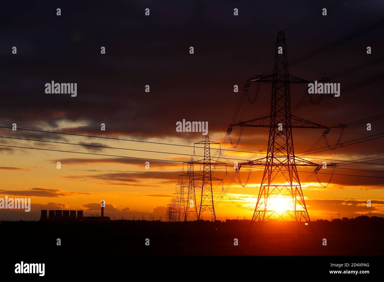 Pylons silhouetted against the sky during sunrise in Ferrybridge,West ...