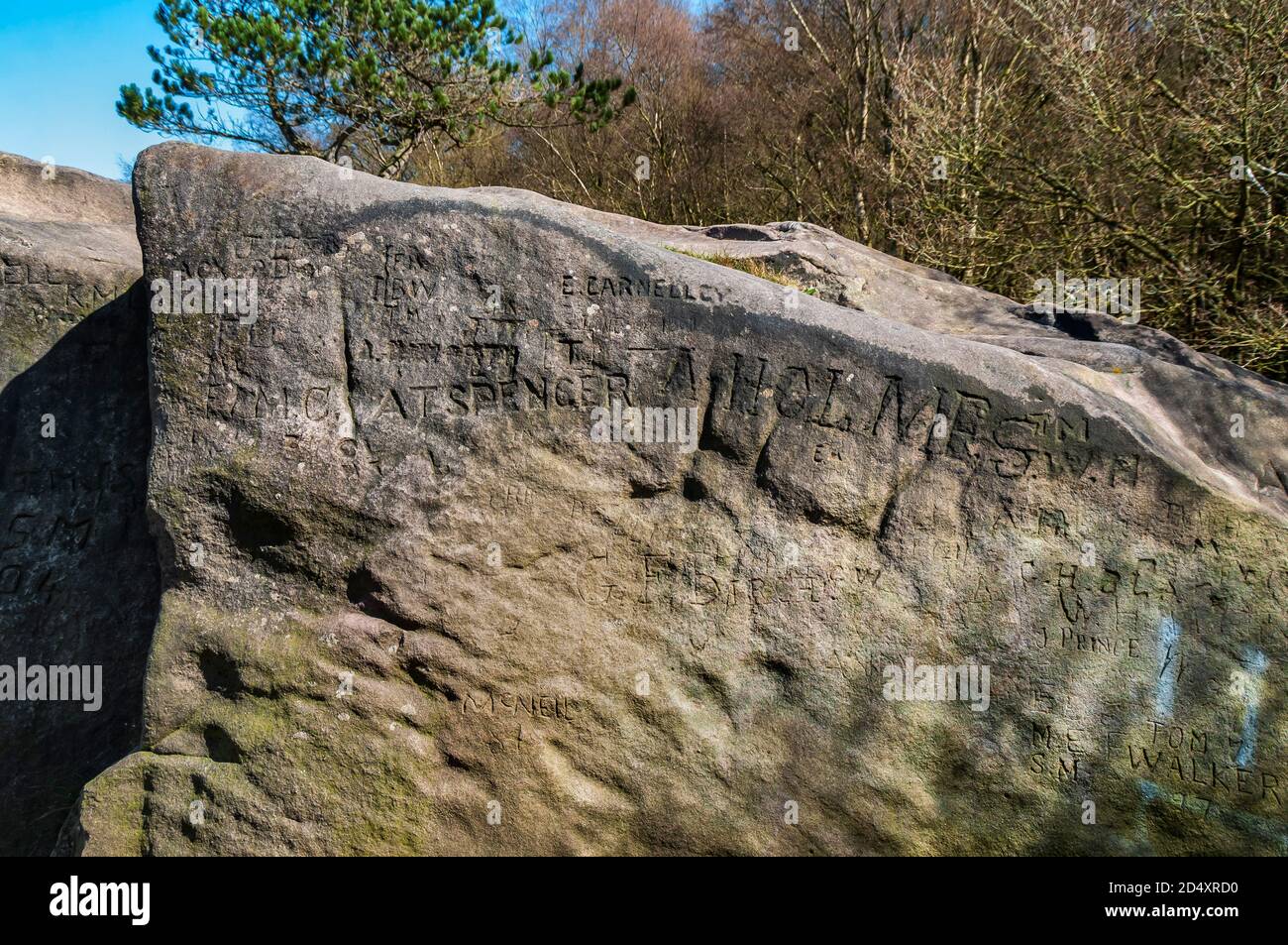 Ancient and modern graffiti carved on boulders of Millstone Grit at the ...