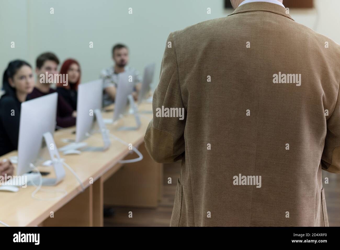 Selective focus on teacher while teaching and explaining lessons to ...